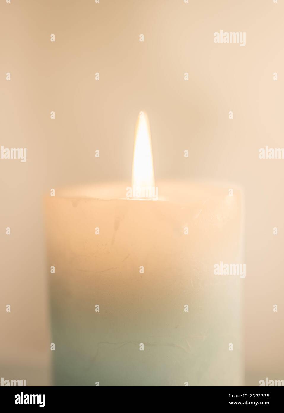 Lit Christmas candle illuminating the interior of a house. High quality ...