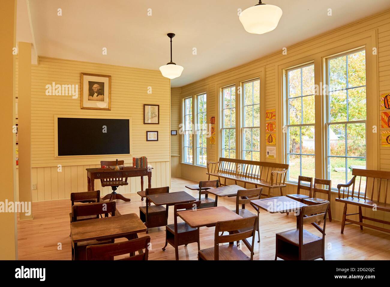 One of the original, old classrooms with wooden desks at the restored ...