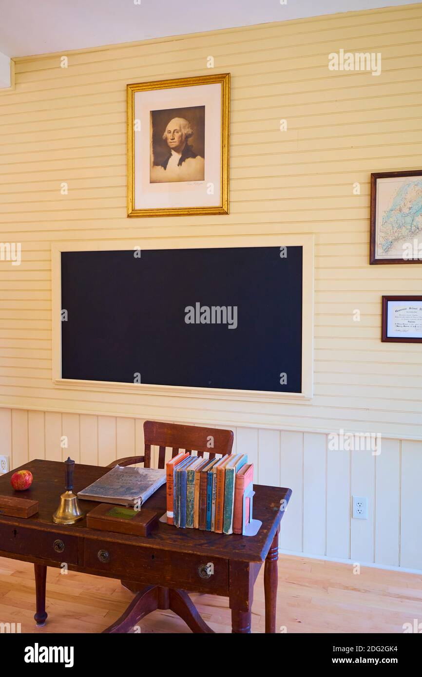One of the original, old classrooms with wooden desks and chalkboard at ...