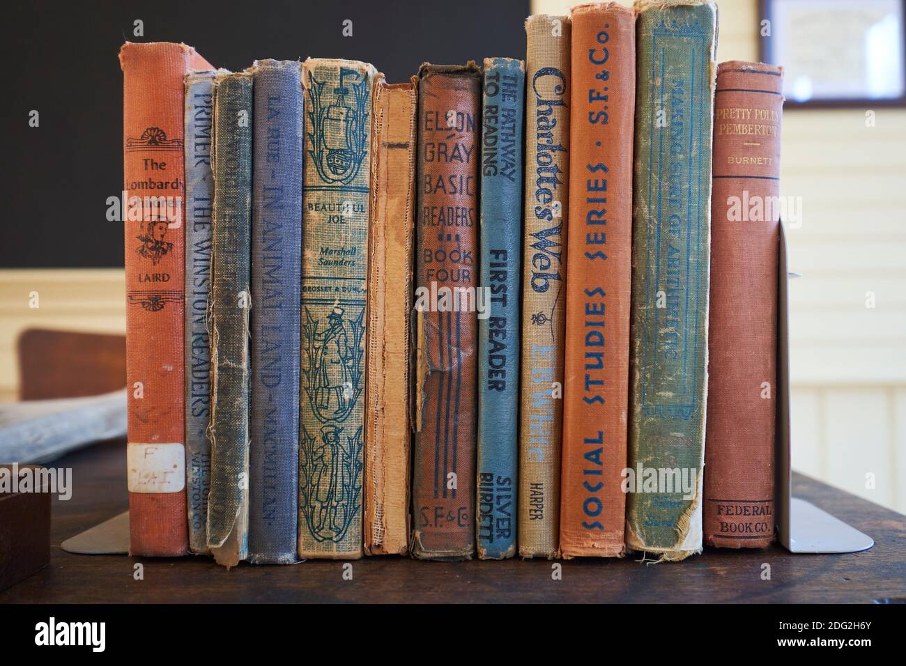 A collection of old, colorful, cloth children's books on the teacher's ...