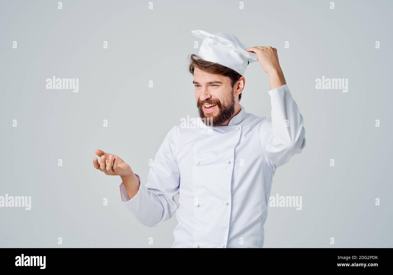 Emotional chef in a headdress gestures Copy Space hands Stock Photo - Alamy