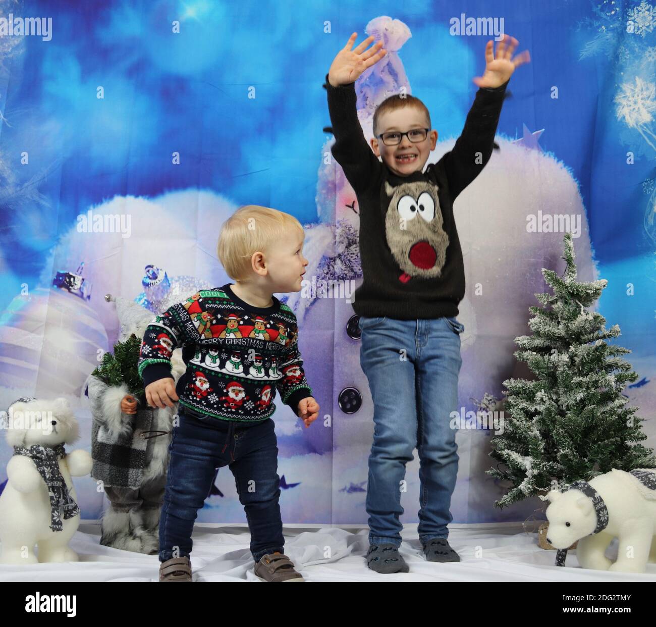 A traditional happy family Christmas photoshoot with a Christmas ...