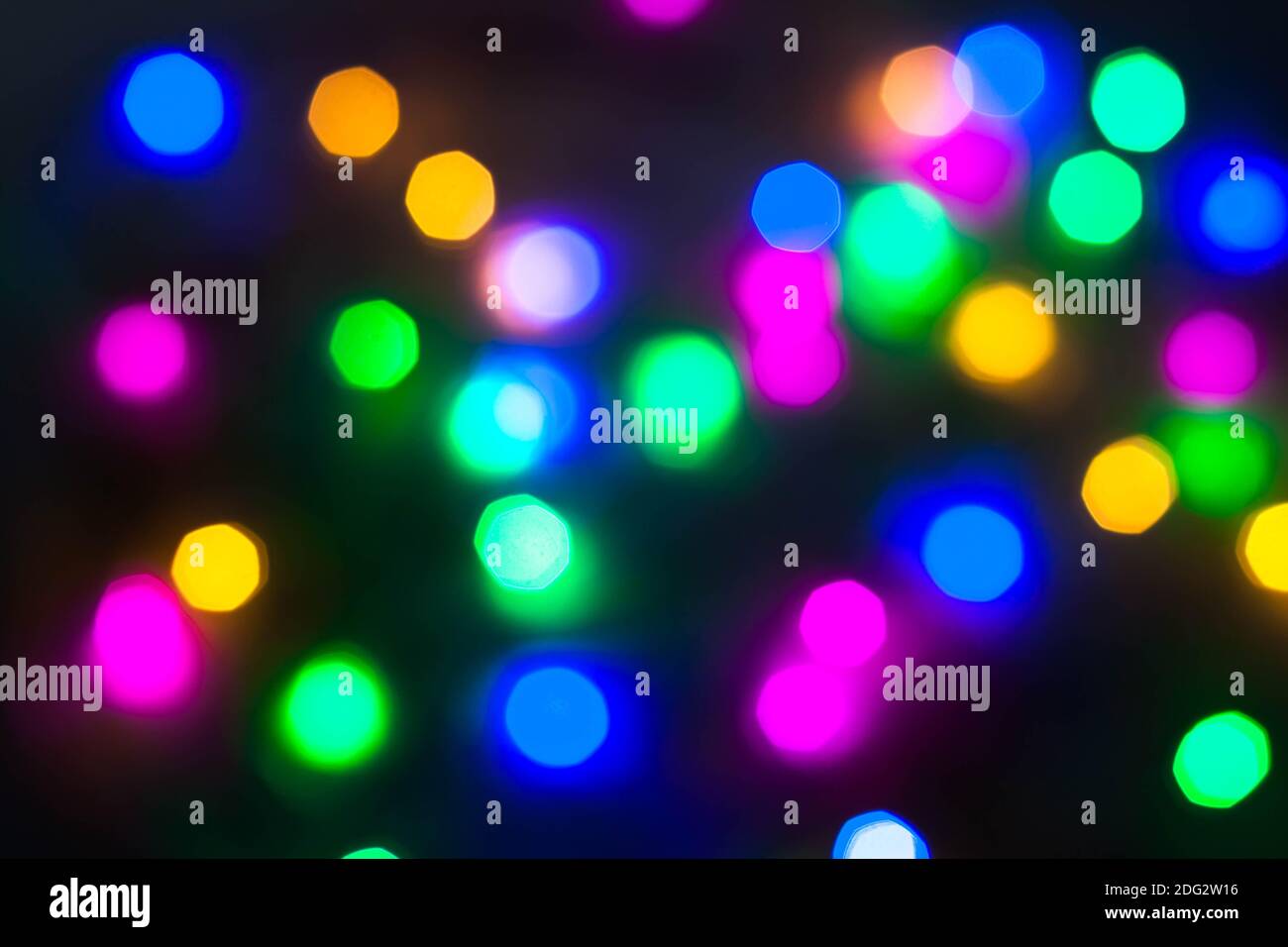 Abstract Christmas New Year garland multicolored neon ights close up ...