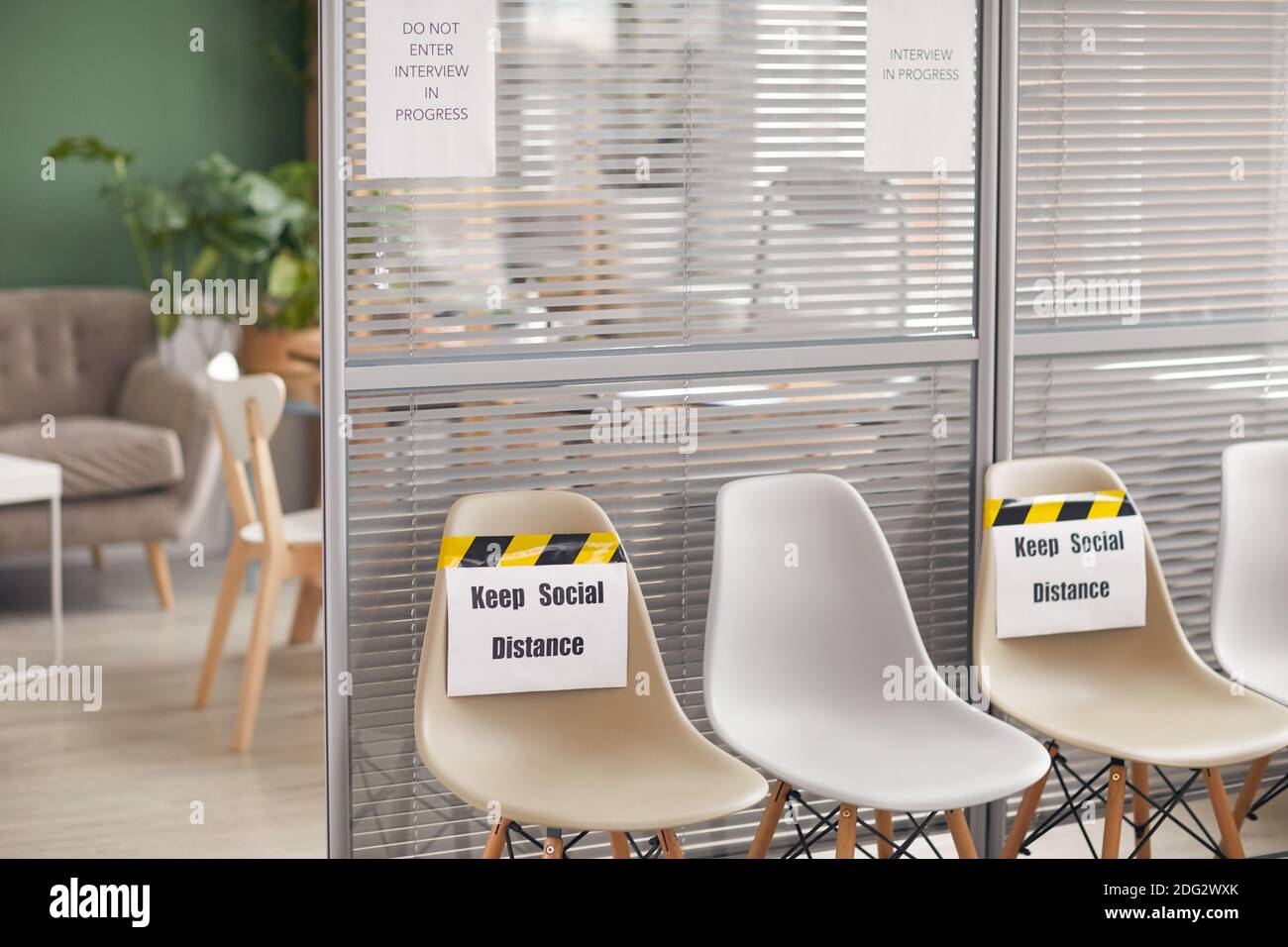 Background image of chairs in row with Keep social distance sign at ...