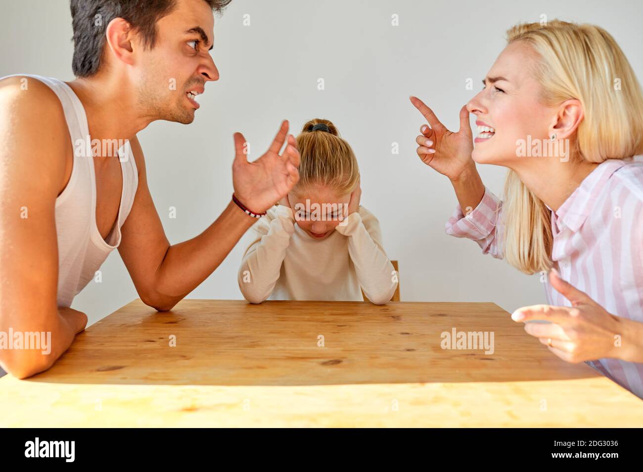Sad girl hearing parents arguing hi-res stock photography and images - Alamy