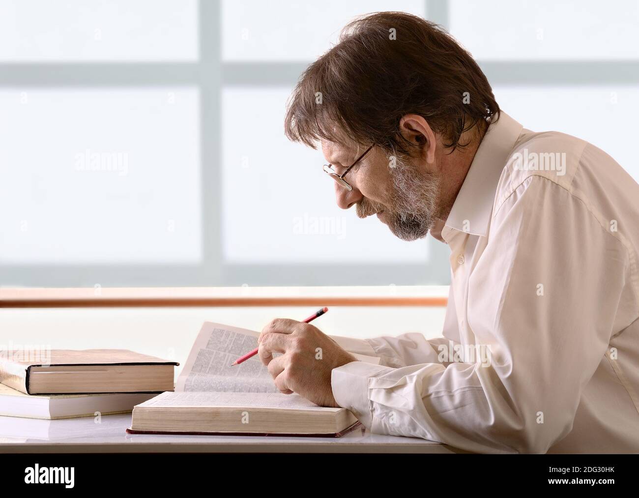 Man behind a desk Stock Photo - Alamy
