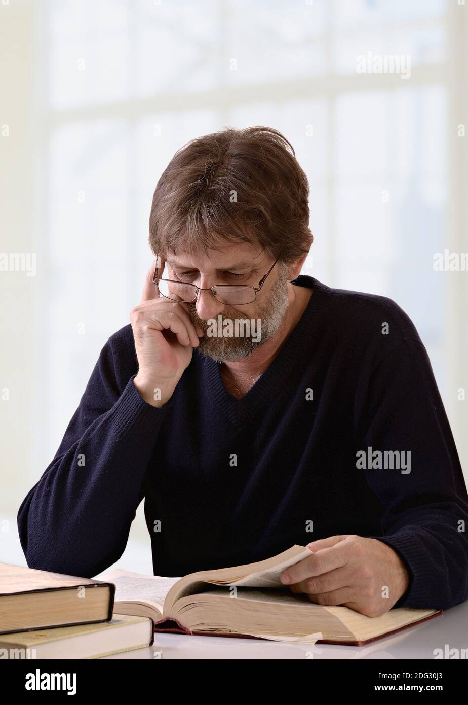 Man reading a book Stock Photo - Alamy