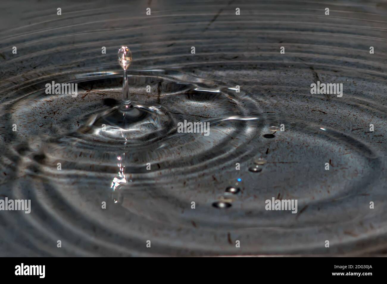 Multi colored water drop bubbling Stock Photo - Alamy
