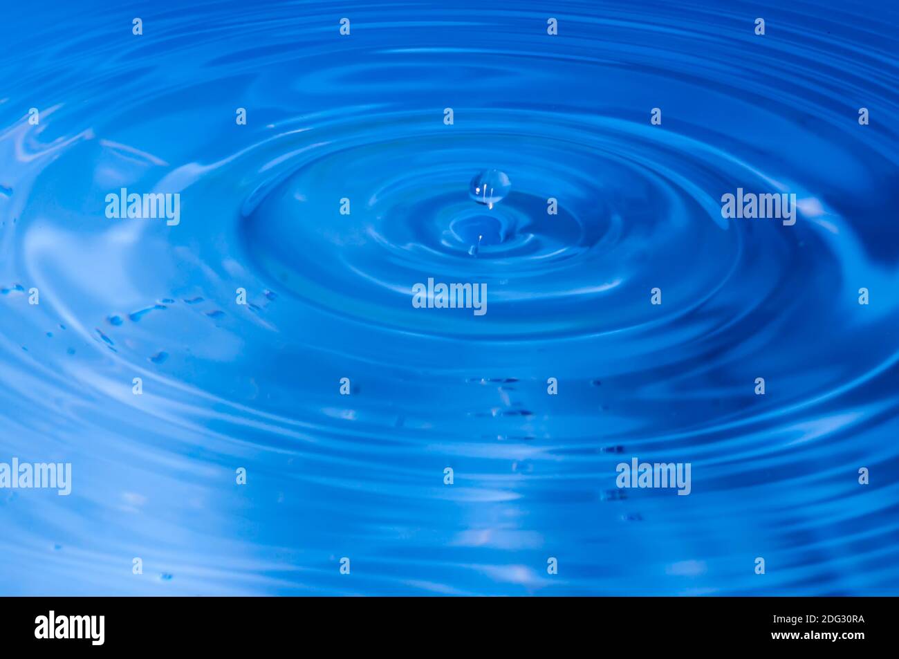 Blue multi colored water drop bubbling Stock Photo - Alamy