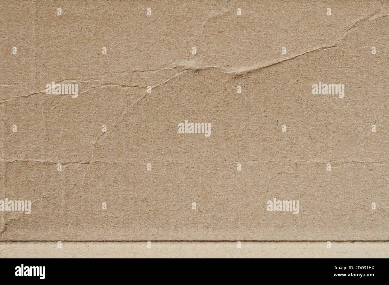 Cardboard brown paper surface with bend lines macro close up view Stock ...