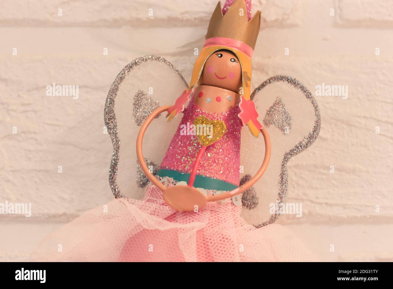 A princess in a pink lush dress with a magic wand, make a wish at your ...