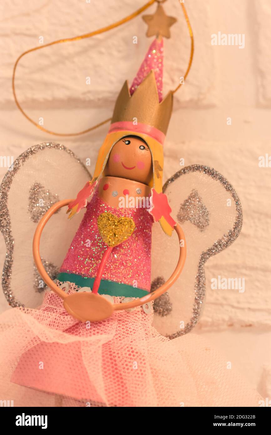 A princess in a pink lush dress with a magic wand, make a wish in New ...