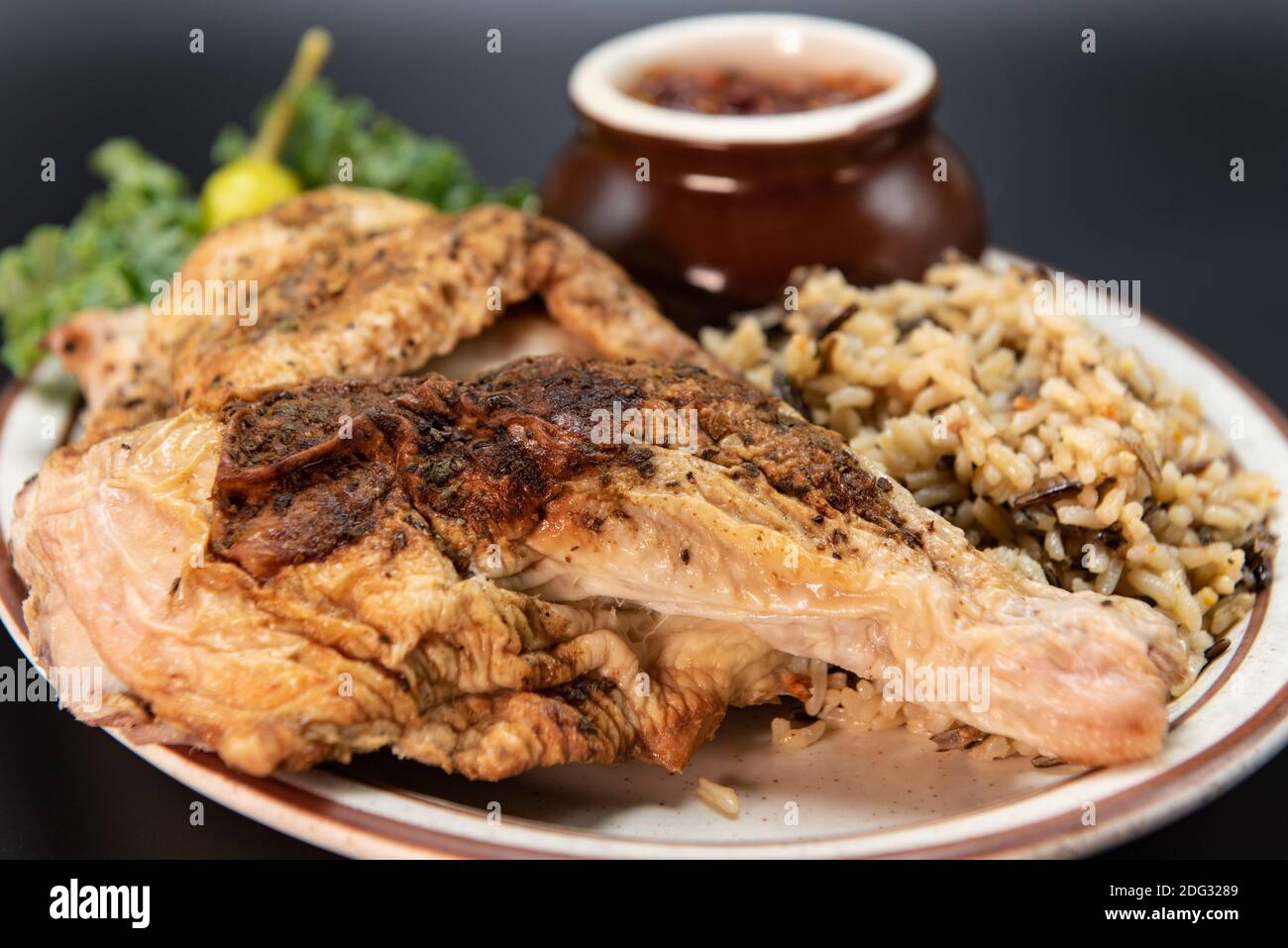 Fresh off the grill half roasted chicken served with all the familiar ...