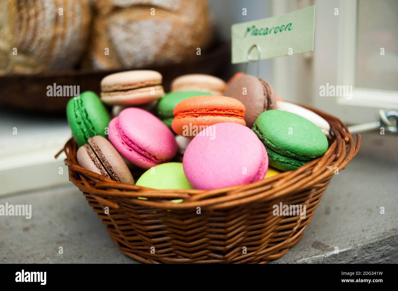basket full of macaroons on a cafeteria shelf outdoors (small depth of ...