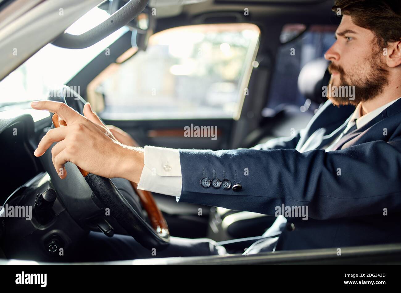 rich man in suit driving car trip road success lifestyle Stock Photo ...