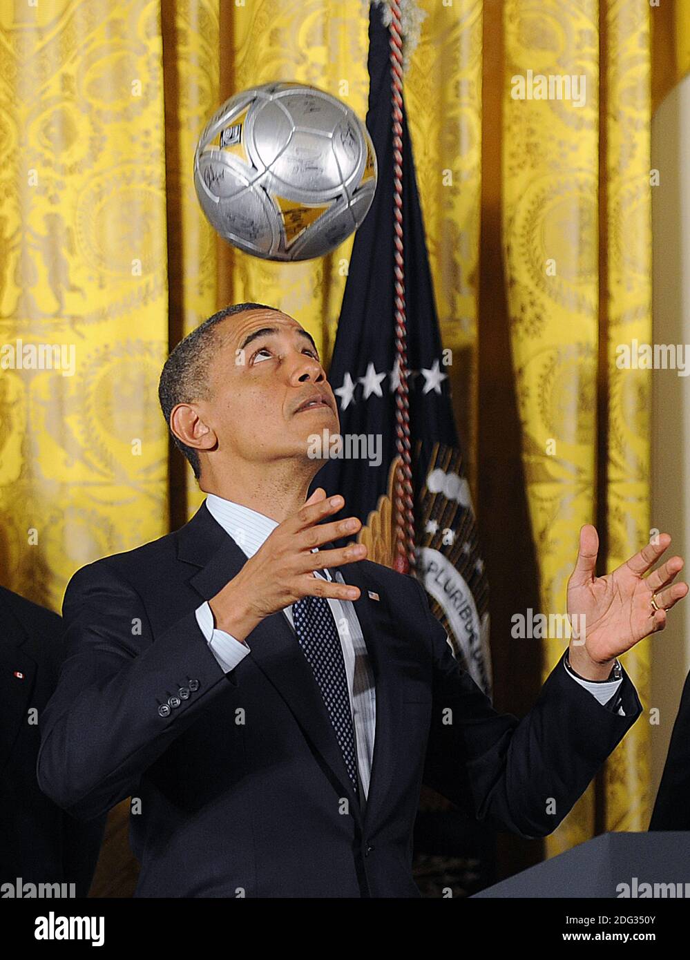 U.S. President Barack Obama juggles with a soccer ball as he welcome ...