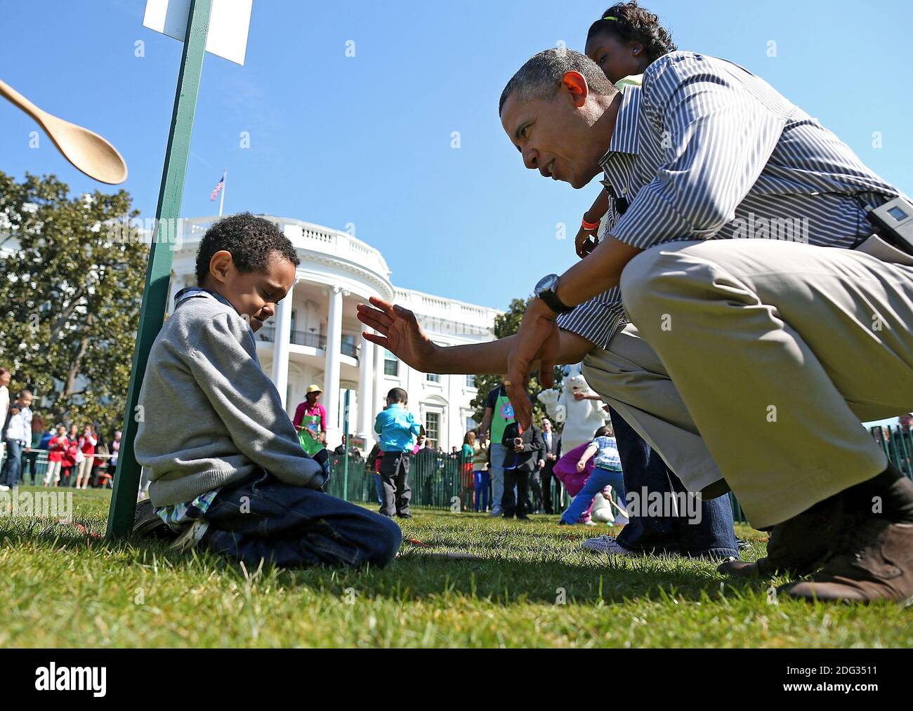 U.S. President Barack Obama comforts crying 5-year-old Donaivan Frazier ...