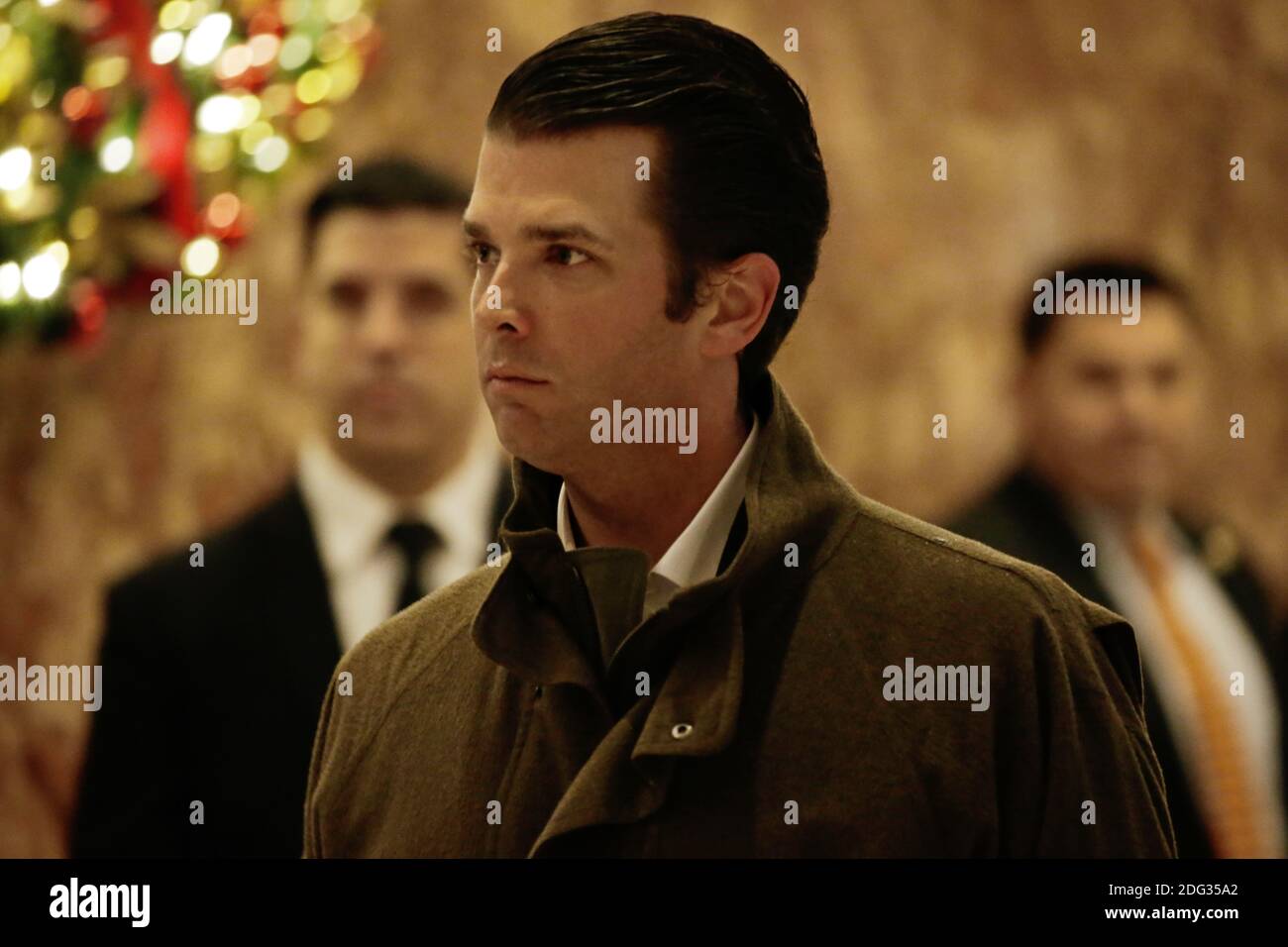 Donald Trump Jr. walks through the lobby of Trump Tower, in New York ...