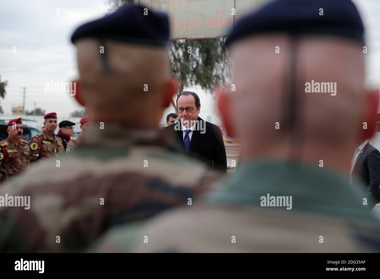 French President Francois Hollande inspects a group of French soldiers ...