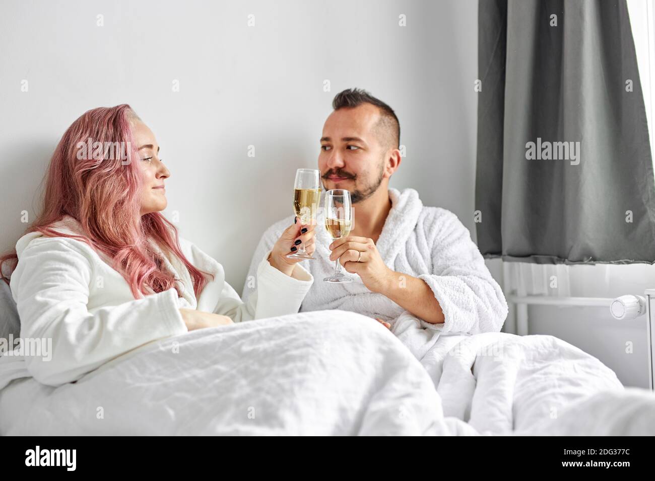Young couple intimate champagne hi-res stock photography and images - Alamy