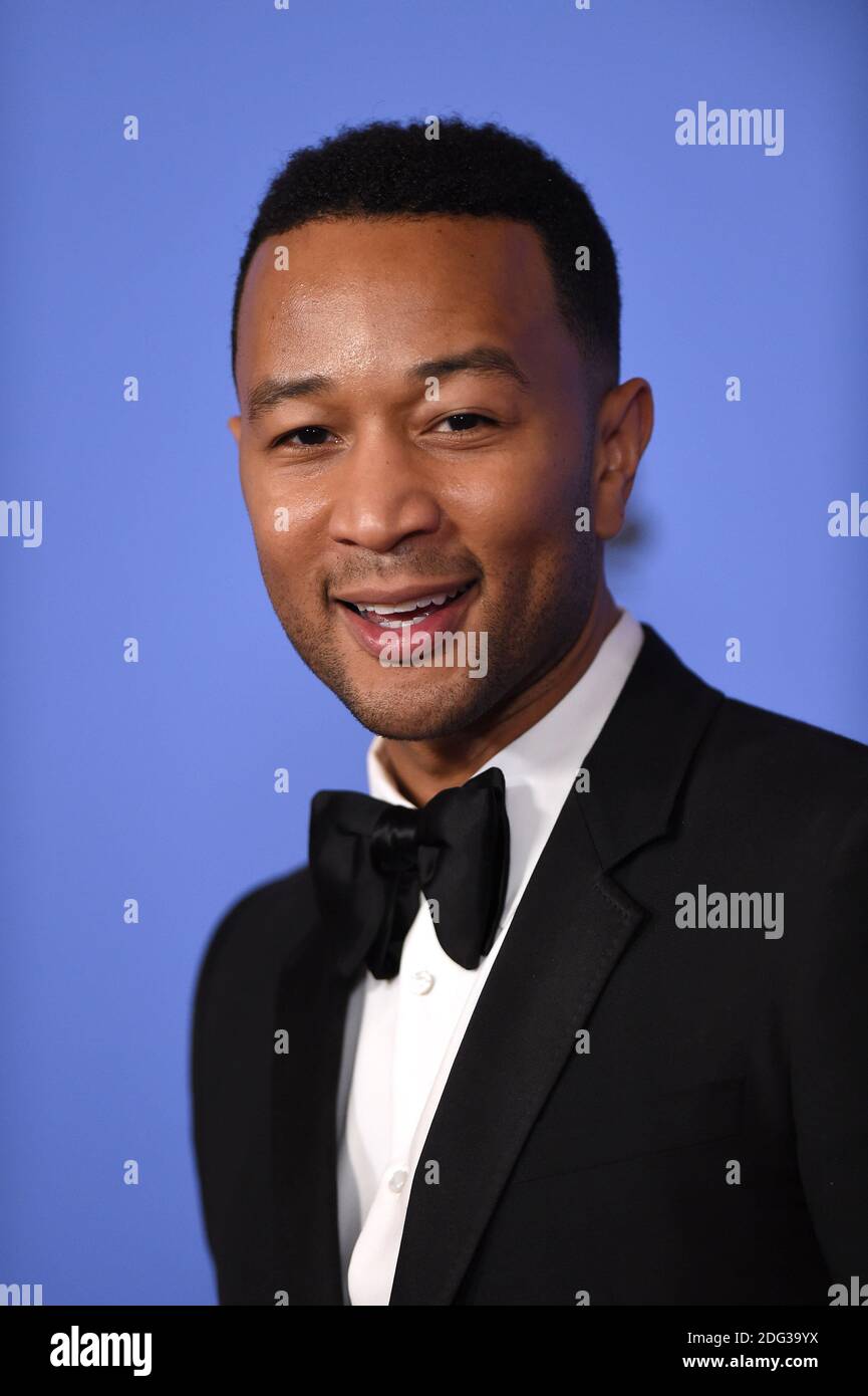 John Legend poses in the press room during the 74th Annual Golden Globe ...