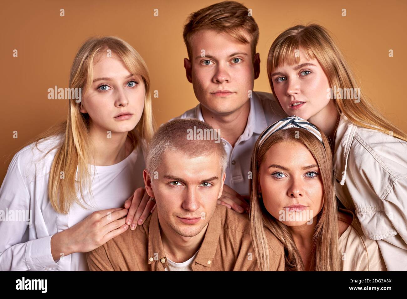unusual group of extraordinary youth posing in trendy wear, caucasian ...