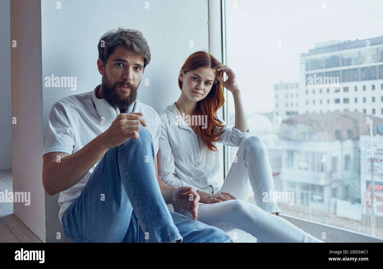 man and woman near the window rest interior fun lifestyle Stock Photo ...