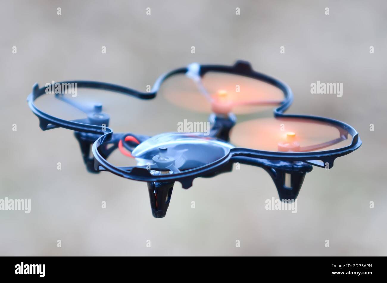 Remote controlled quadcopter drone in mid air Stock Photo - Alamy