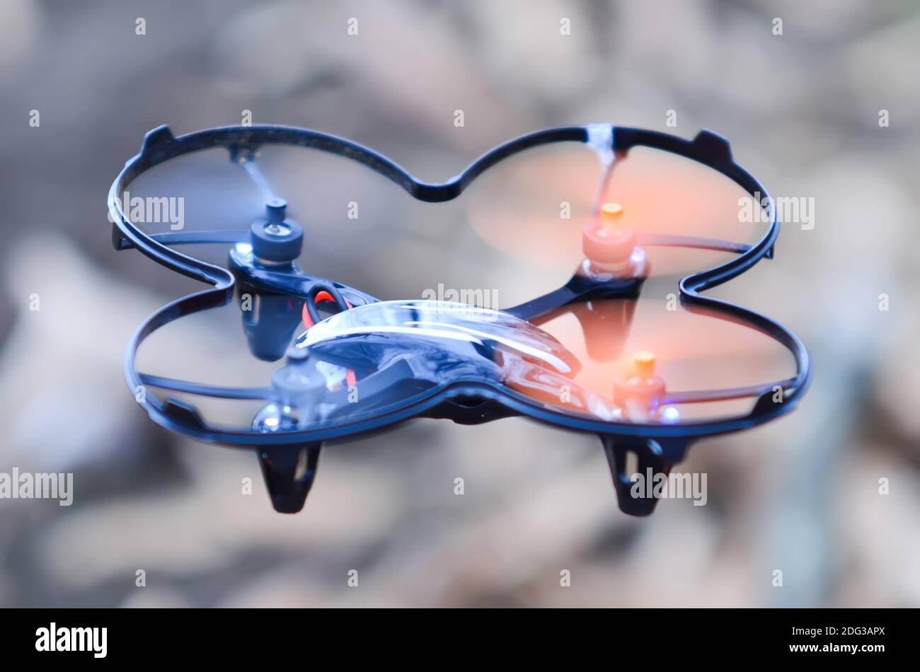 Remote controlled quadcopter drone in mid air Stock Photo - Alamy