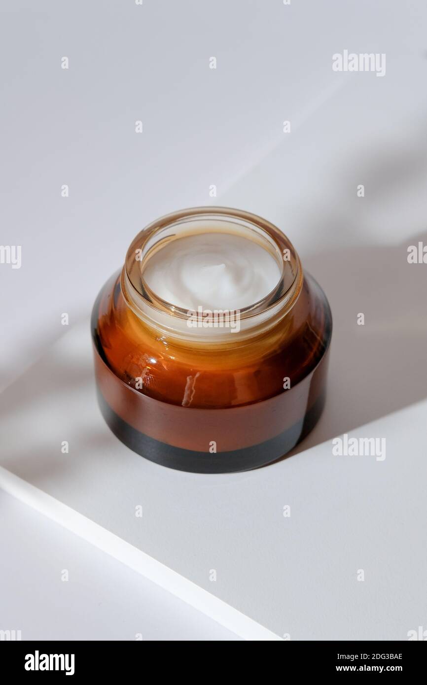 Moisturizing cream in brown amber glass jar. Natural organic cosmetic ...