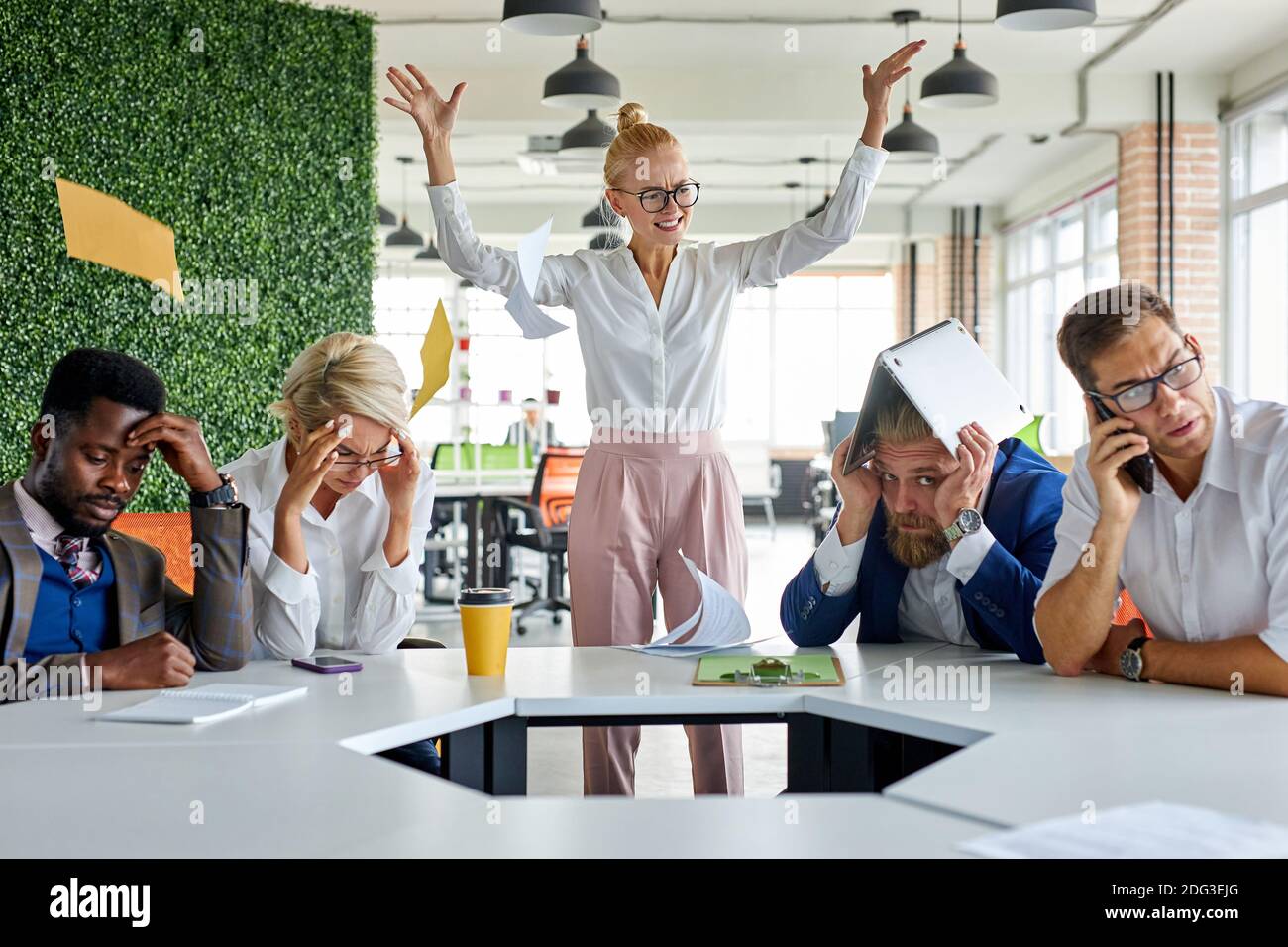 rude angry female boss executive is dissatisfied irritated by employees ...