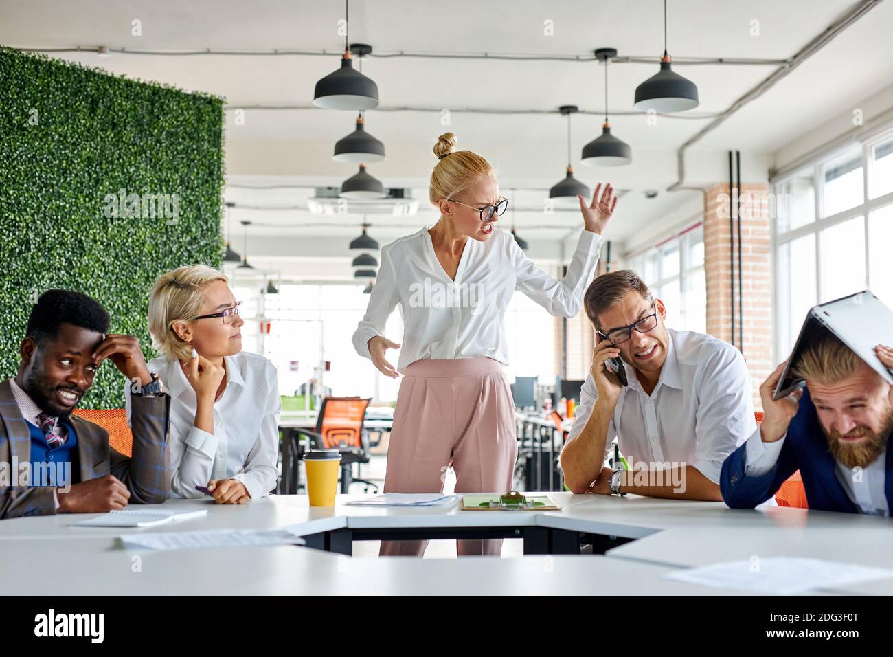 rude angry female boss executive is dissatisfied irritated by employees ...