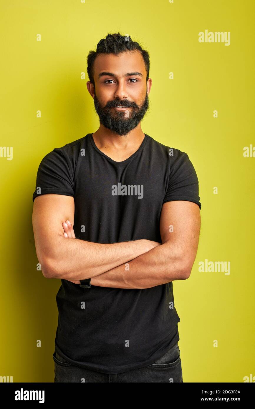 confident concentrated arabic male posing isolated in studio, indian ...