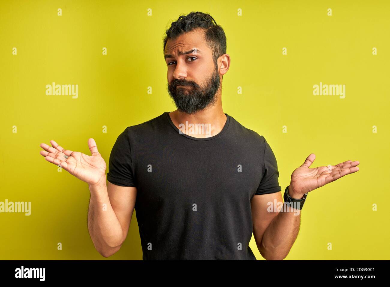 arabian man looking worried, anxious about question, stand with spread ...