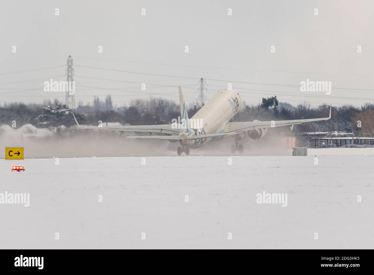 Flybe Embraer ERJ-195 taking off at London Southend Airport in snow ...