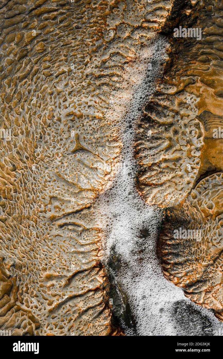 Abstract natural rocky background of the stones with spring water ...