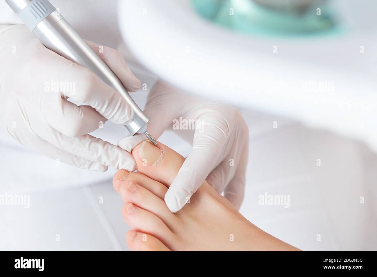 Peeling feet with special electric device.Professional hardware ...