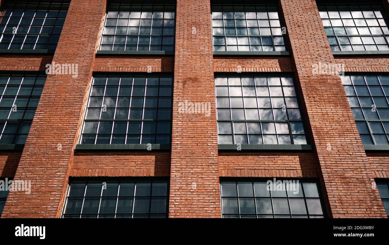 Front view windows of a restored historic shoe warehouse brick building ...