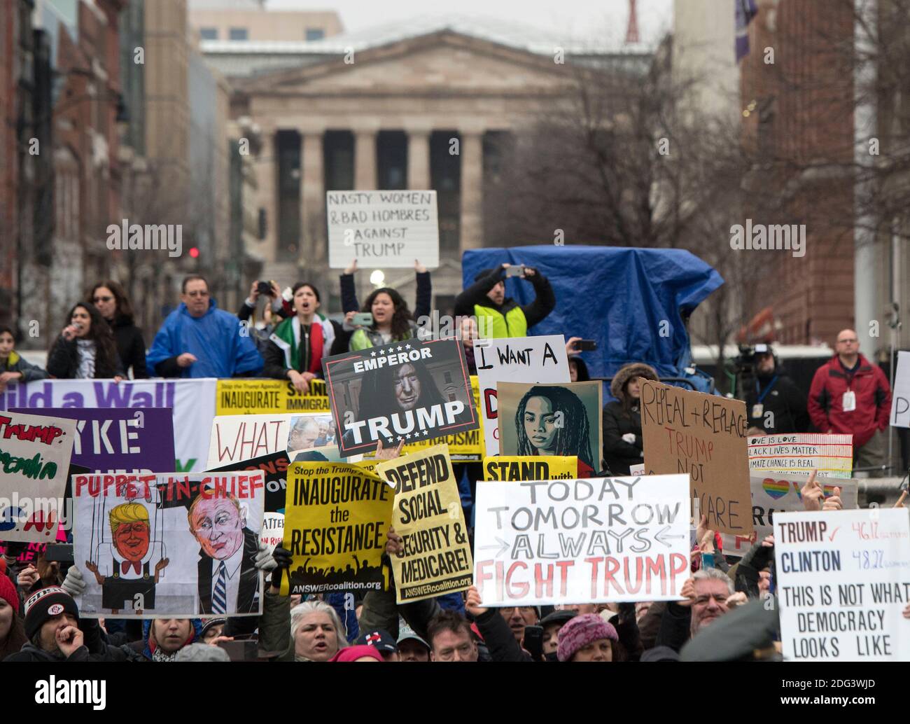 Protesters demonstrate as President Donald Trump and First Lady Melania ...