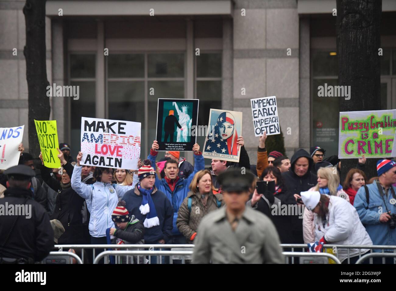 President Barack Obama's motorcade passes demonstrators along the route ...