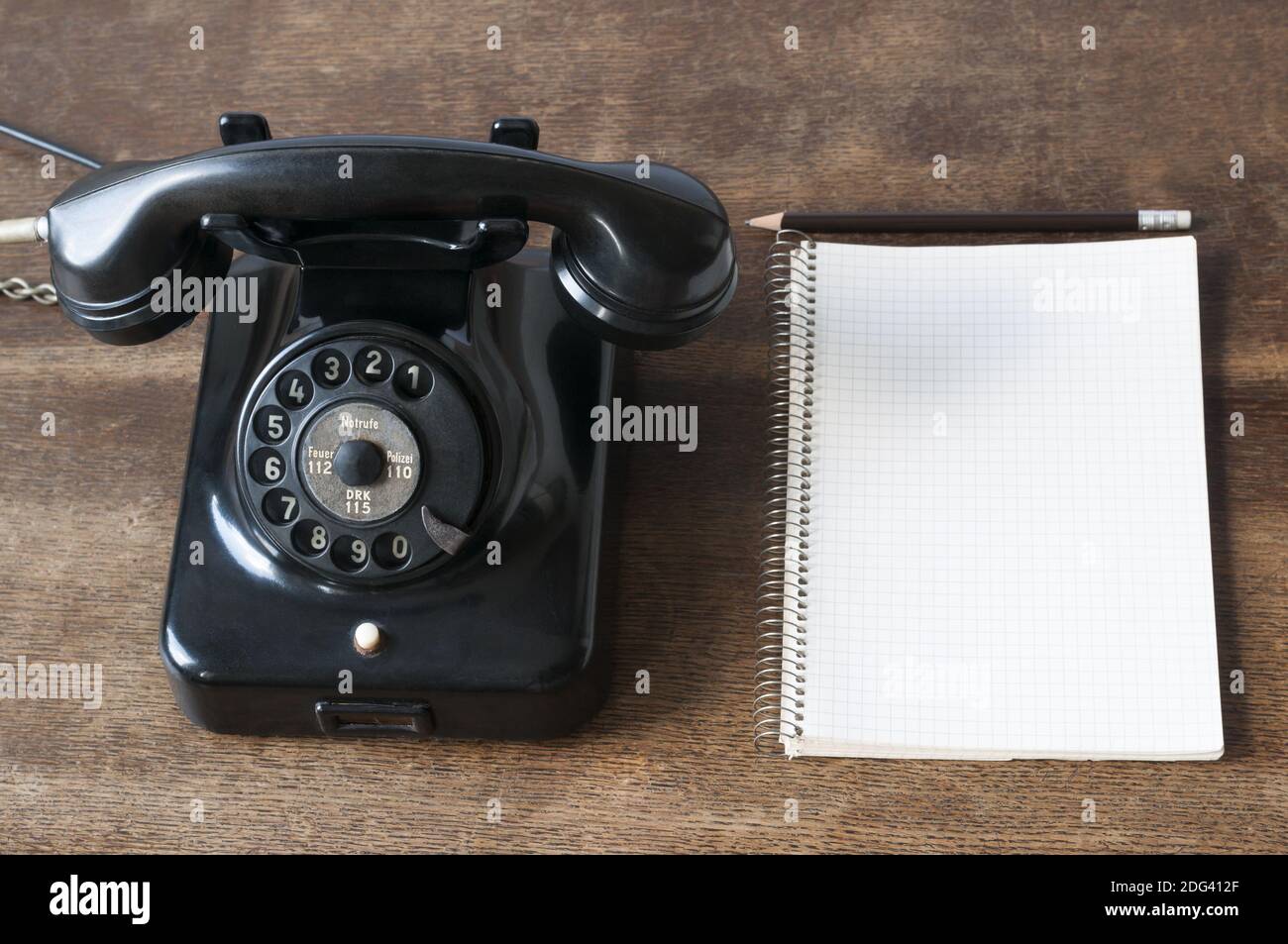 Old phone with writing pad for Copy Space and pencil on a desk Stock ...