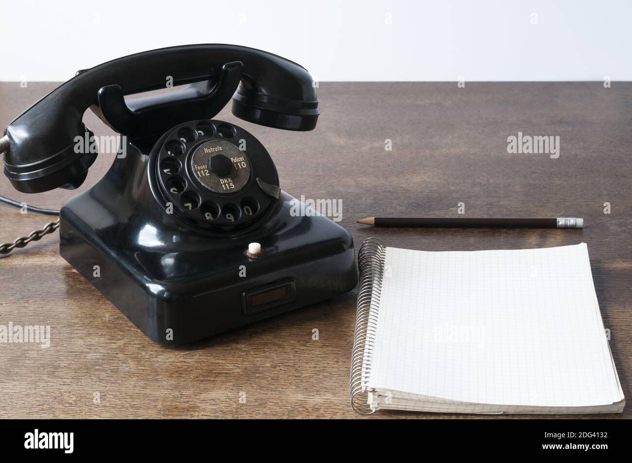 Old phone with writing pad for Copy Space and pencil on a desk Stock ...