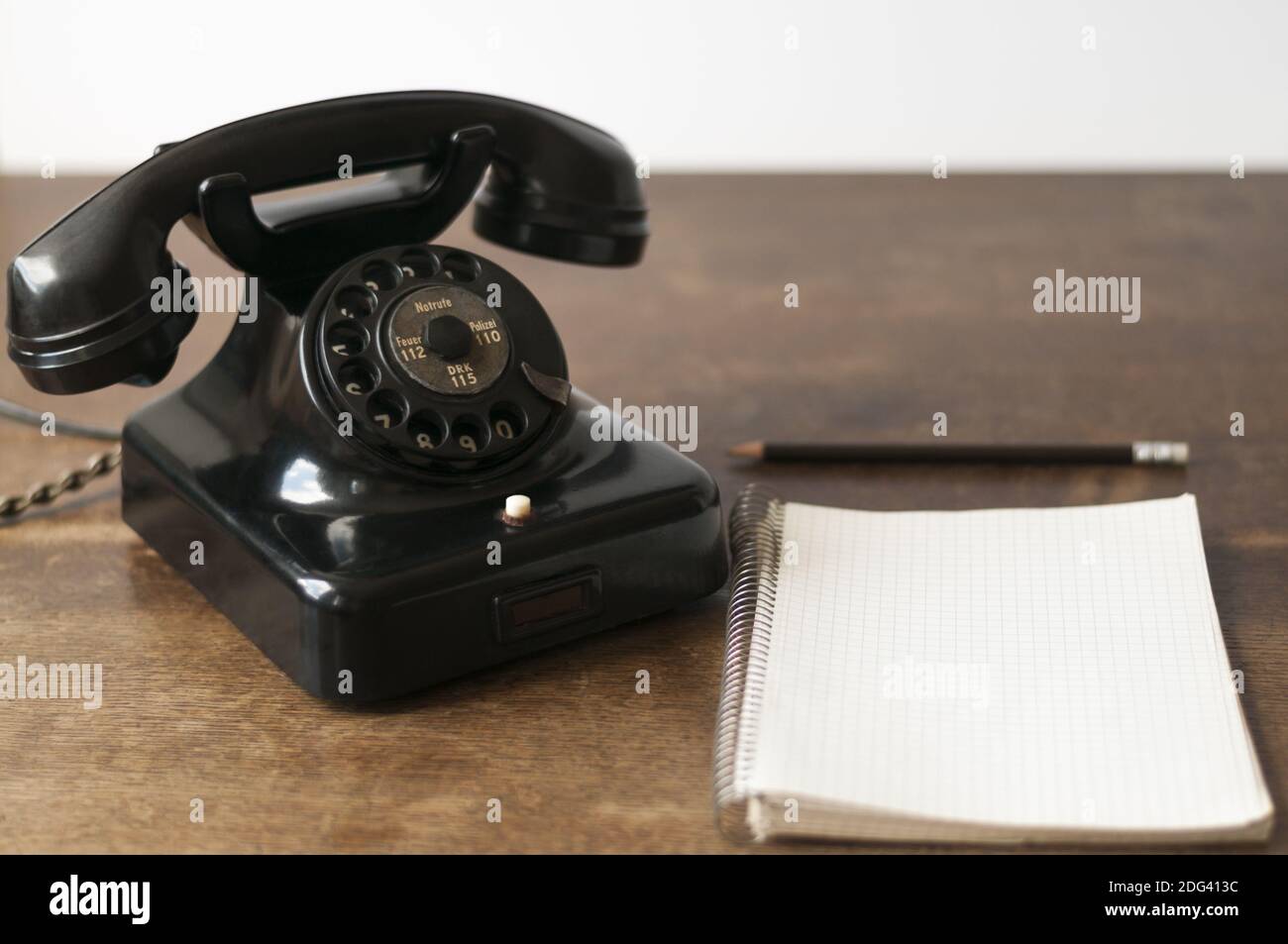 Old phone with writing pad for Copy Space and pencil on a desk Stock ...