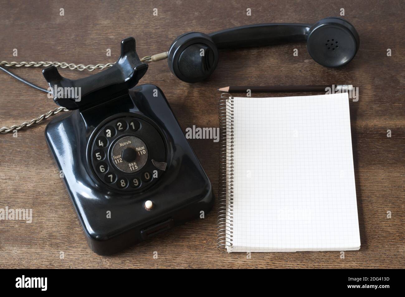 Old phone with writing pad for Copy Space and pencil on a desk Stock ...