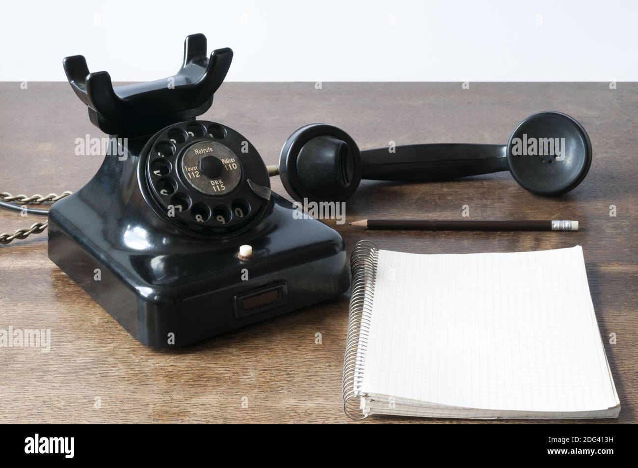 Old phone with writing pad for Copy Space and pencil on a desk Stock ...