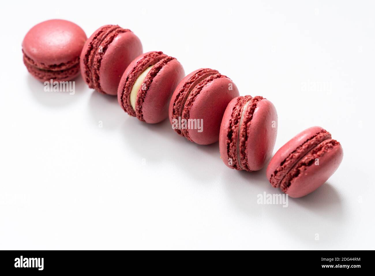 Red color french dessert macarons Stock Photo - Alamy