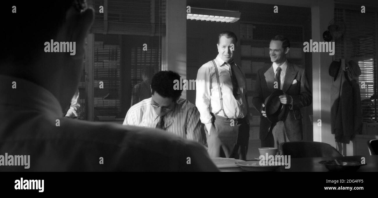 MANK, from left: Adam Shapiro as George S. Kaufman, Gary Oldman as ...