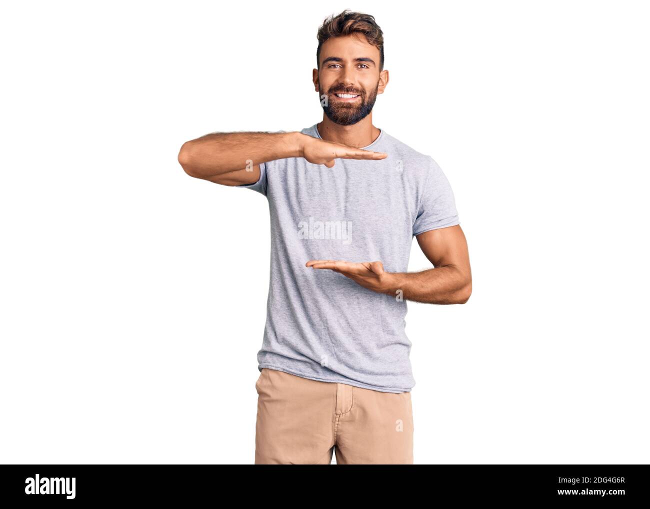 Young hispanic man wearing casual clothes gesturing with hands showing ...
