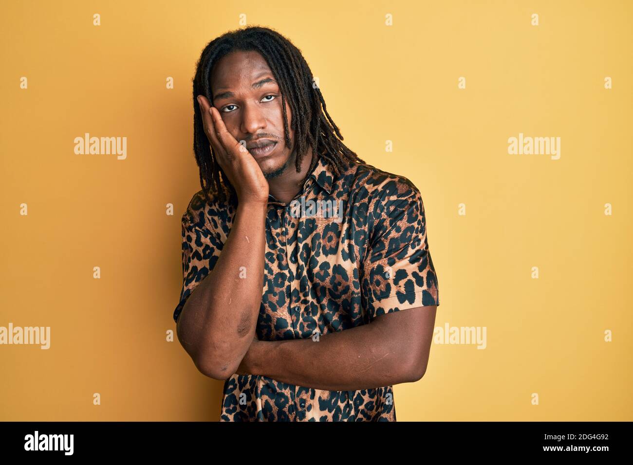 African american man with braids wearing leopard animal print shirt ...