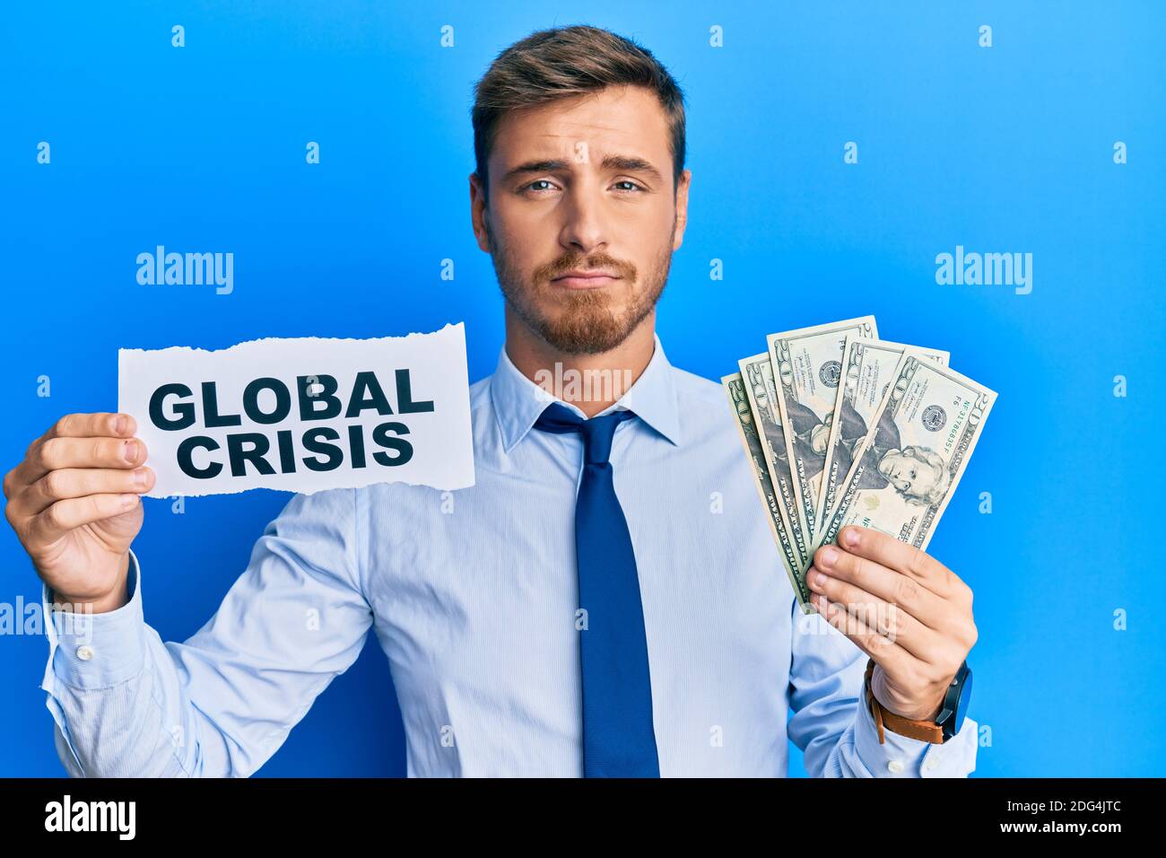 Handsome caucasian business man holding dollars on global crisis ...